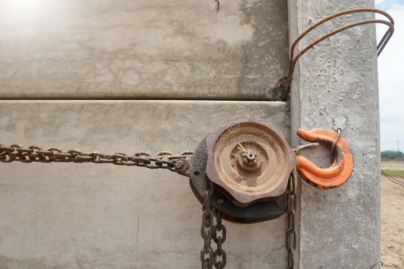 A Chain Hoist is Attached To the Wall Column. Stock Image - Image of ...