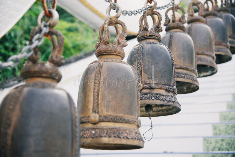 A Chain of Large Bells Hangs Stock Photo - Image of chain, memorial ...