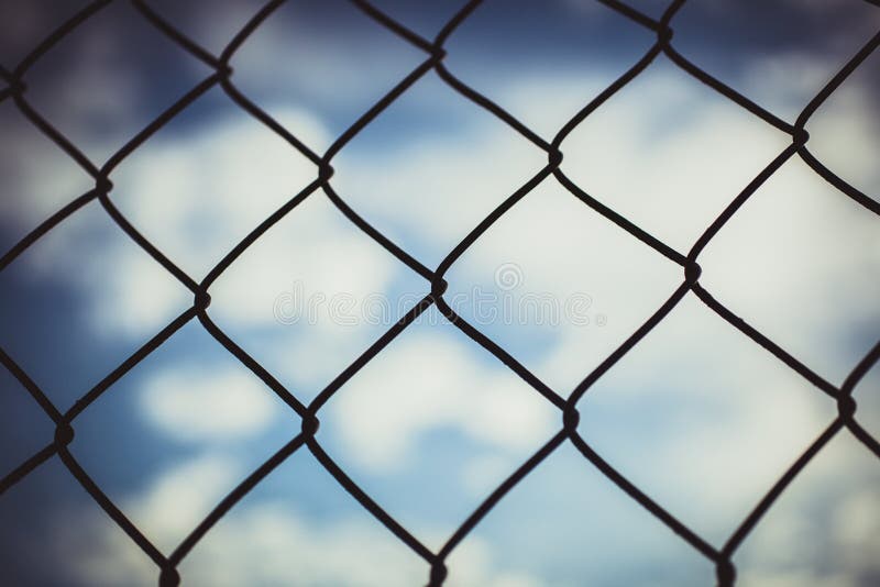 Chain Link Fence with Blue Sky Background in Retro Stock Photo - Image ...