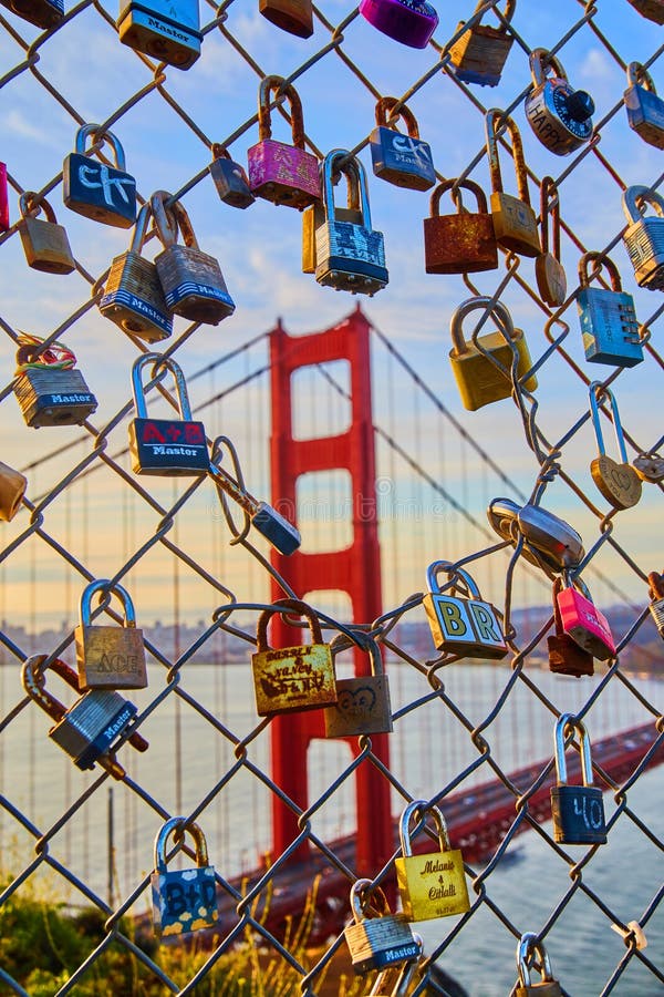 Chain Link Fence Covered in Locks with Golden Gate Bridge in Distance ...