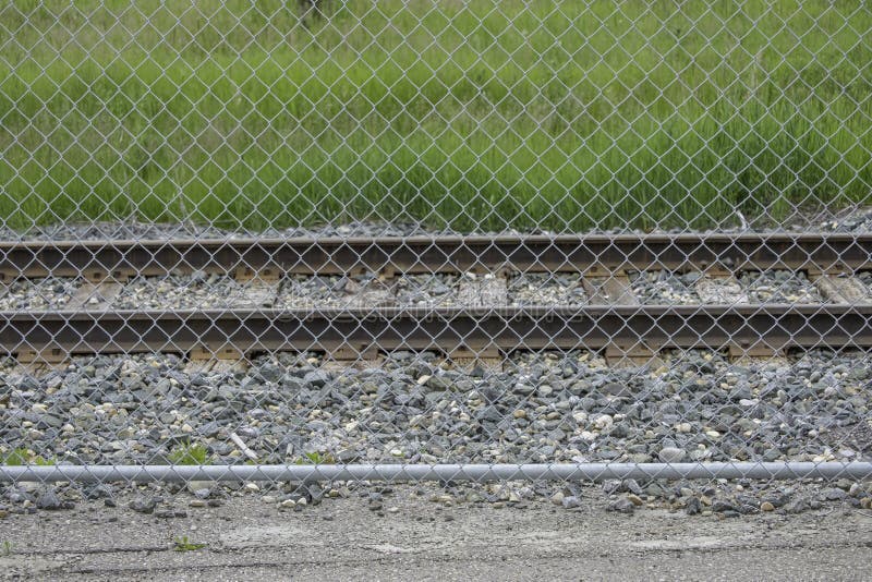 Chain Link Mesh Fence in Front of Railway Track Stock Photo - Image of ...