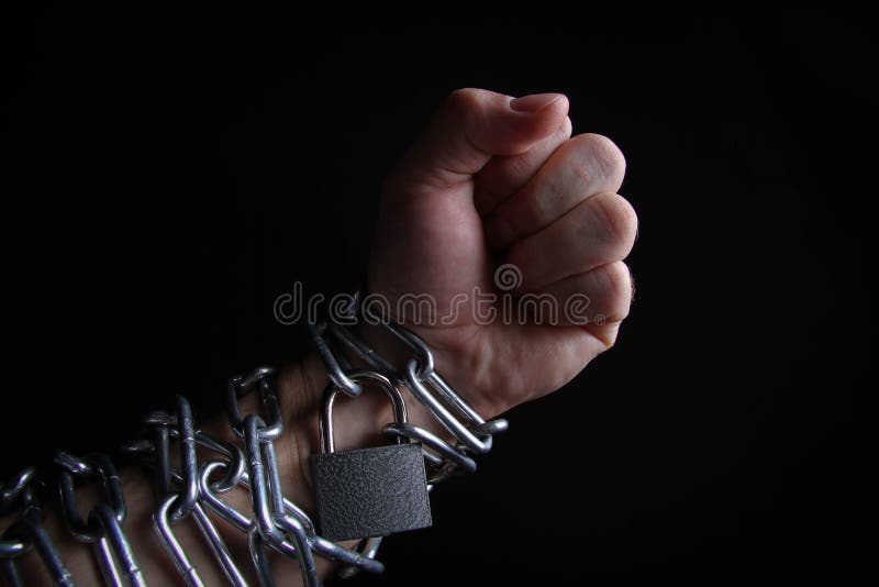 Chain and Lock on Hand. Arrest of a Criminal. Handcuffs on the Prisoner ...