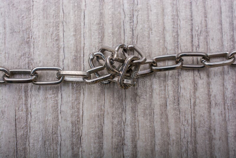 Chain Made of Silver Color Metal on a Grey Background Stock Photo ...