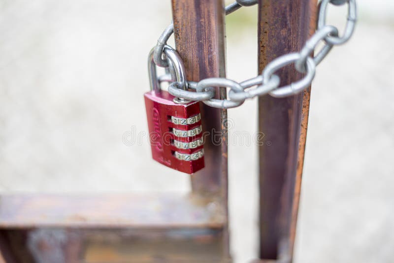 Chain of Metallic Links Around a Gate Locked by a Red Padlock with a ...
