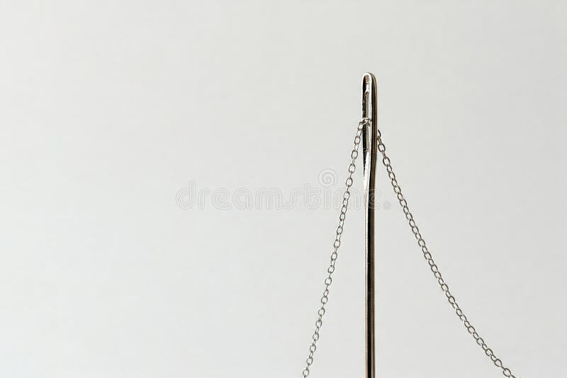 A Chain Passing through the Eye of the Needle. Space for Text. Stock ...