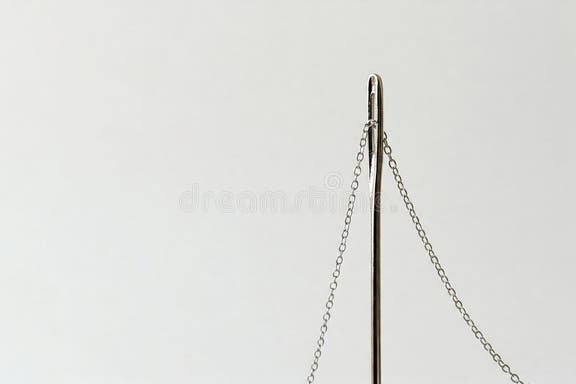 A Chain Passing through the Eye of the Needle. Space for Text. Stock ...