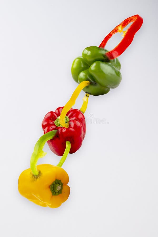 Chain of Peppers Intertwined by Same Vegetable Rings Stock Photo ...