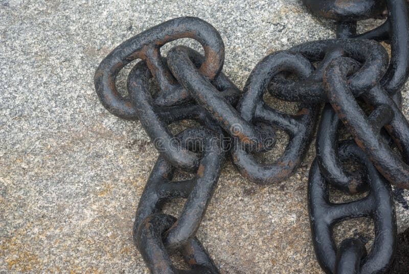 Chain on rock stock photo. Image of concept, solid, rusty - 58666128