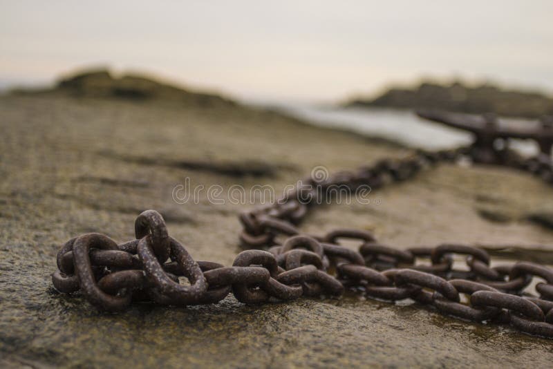 Chain on rock stock image. Image of rusty, vintage, brown - 45017929