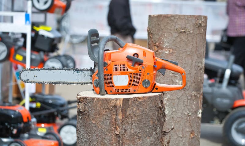 Chain saw on log stock photo. Image of construction, powered - 15997660