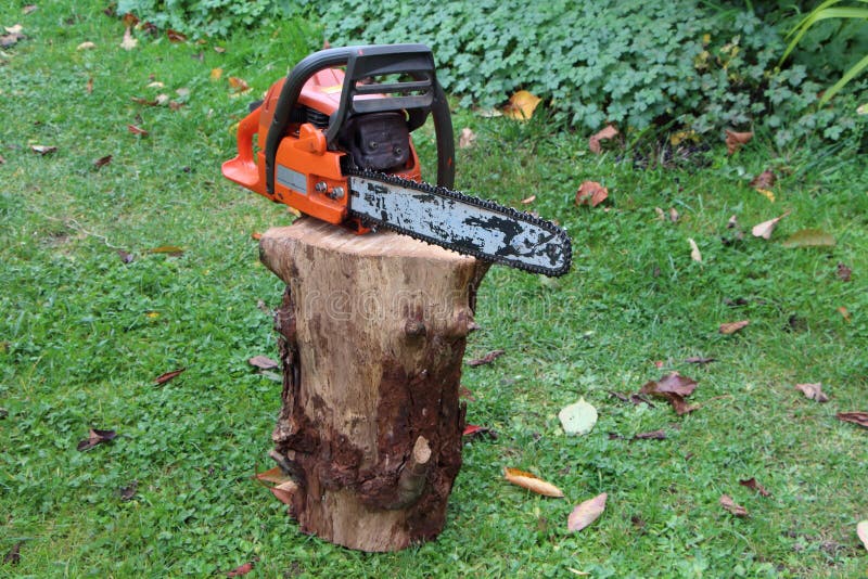 Chain saw on a log stock image. Image of chain, garden - 96478553