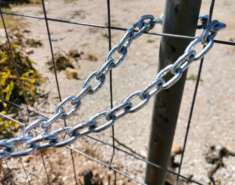 A Chain Tied To an Iron Gate Closes the Gate Stock Photo - Image of ...
