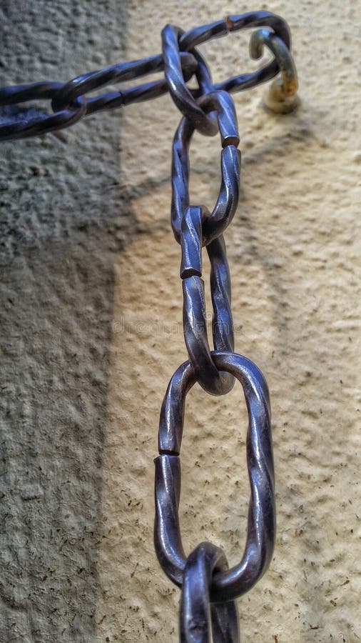Chain on the wall stock image. Image of urban, wall - 115251391