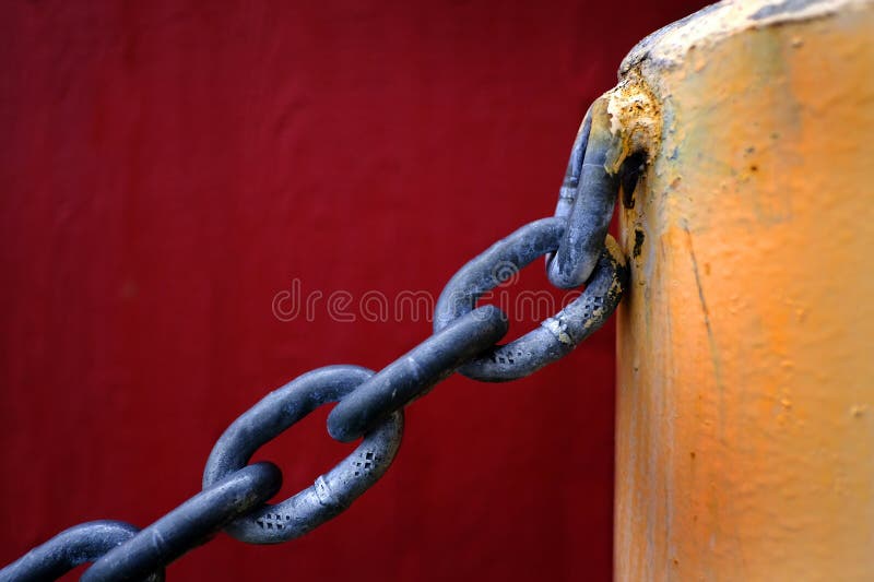Chain and Yellow Post Protection and Security with Red Background Stock ...