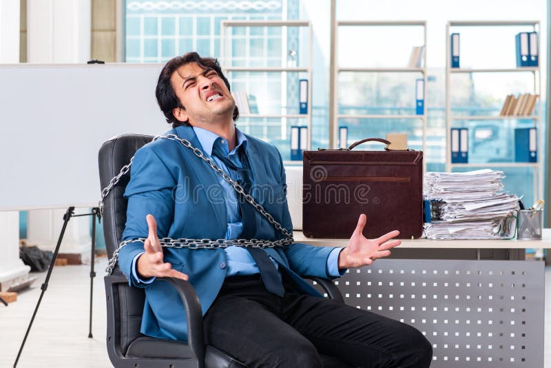 The Chained Male Employee Unhappy with Excessive Work Stock Image ...