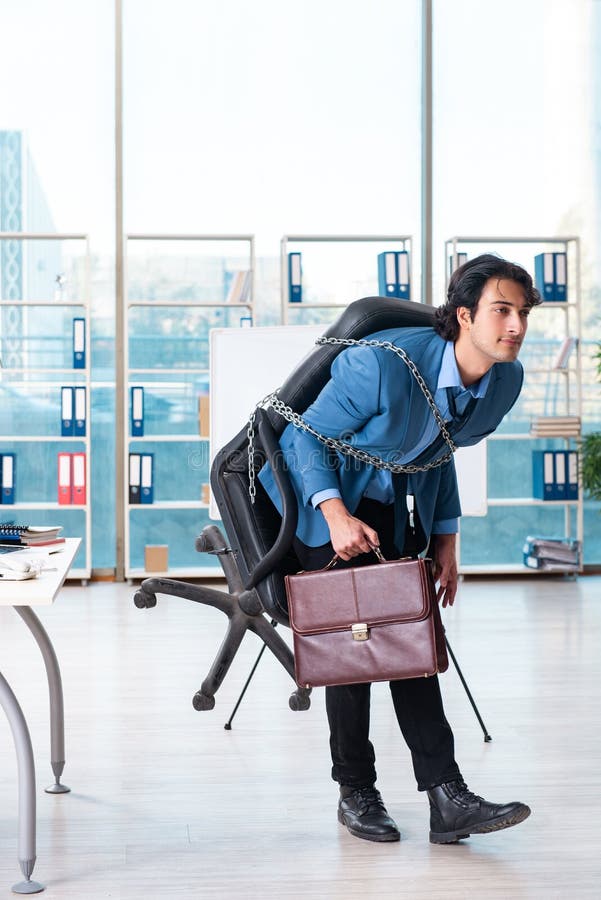 The Chained Male Employee Unhappy with Excessive Work Stock Image ...