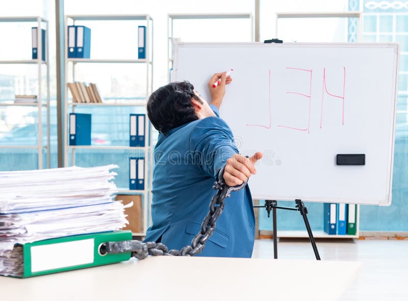 Chained Male Employee Unhappy with Excessive Work Stock Photo - Image ...
