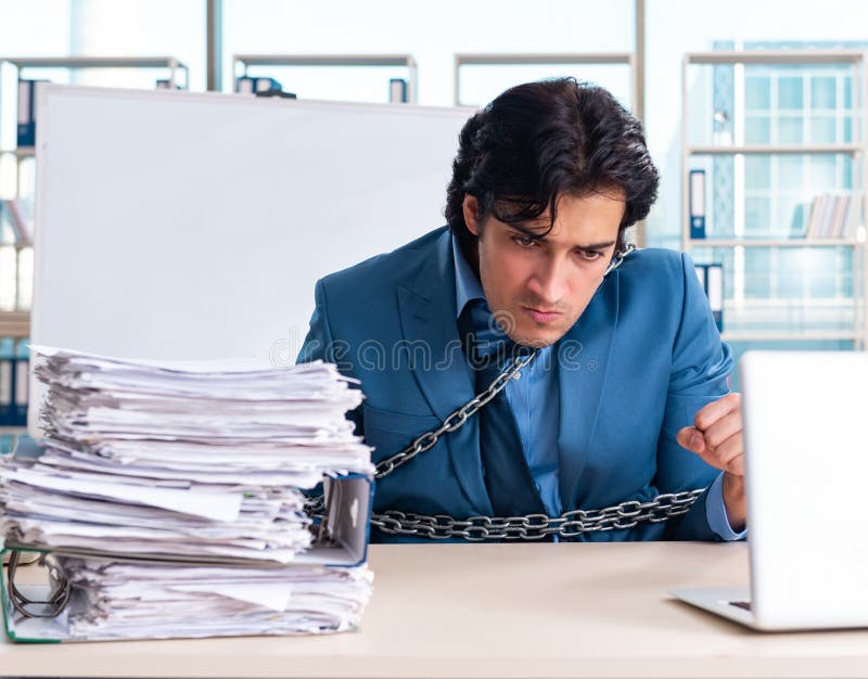 Chained Male Employee Unhappy with Excessive Work Stock Image - Image ...