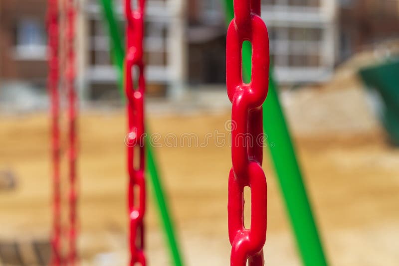 Chains Covered with Red Rubber Coating for Safety on Swings in the ...