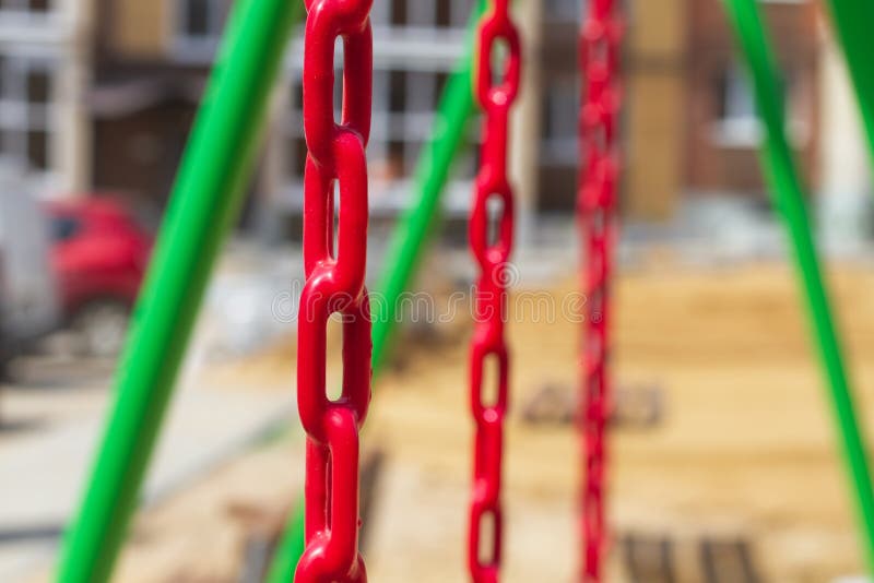 Chains Covered with Red Rubber Coating for Safety on Swings in the ...