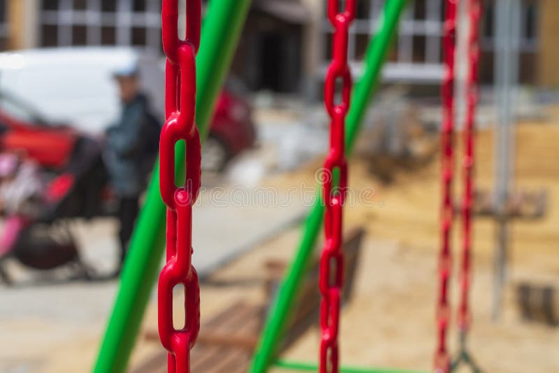 Chains Covered with Red Rubber Coating for Safety on Swings in the ...