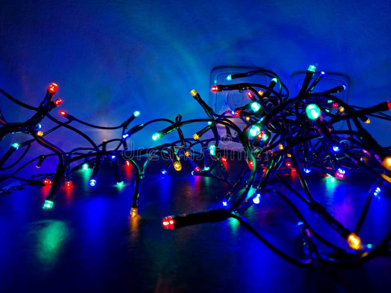 Chains of Light on a Dark Blue Background Resemble a Stock Image ...