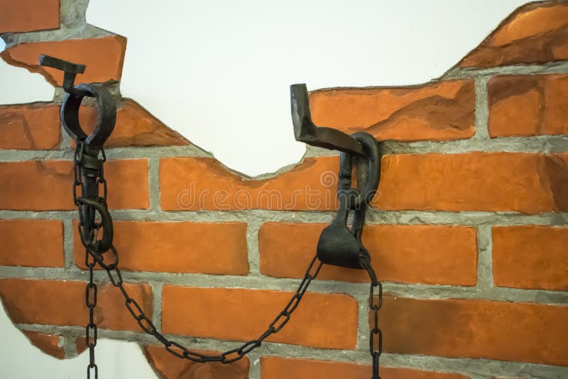 The Chains, the Slave Chains on the Wall of Red Brick Stock Image ...