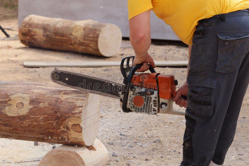 Chainsaw in Action Masterfully Cutting Logs with Precision and ...