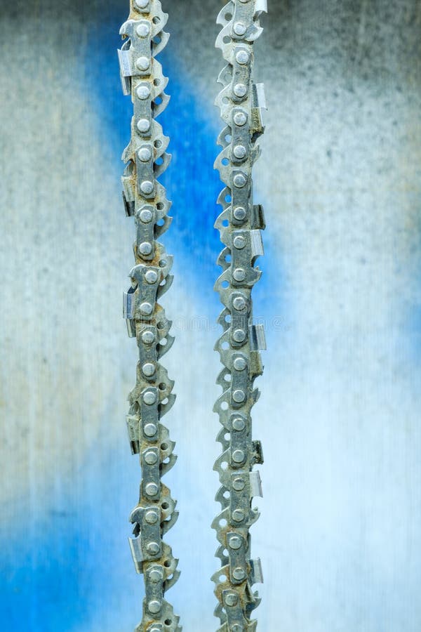 Chainsaw Blade Chain Close-up on the Background of the Old Wall in the ...
