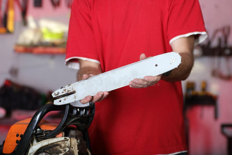 Chainsaw on a Table in a Garage Stock Photo - Image of garage, sawing ...