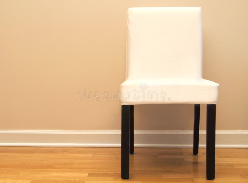 Chair Against a Beige Wall in a Home Stock Image - Image of chair ...