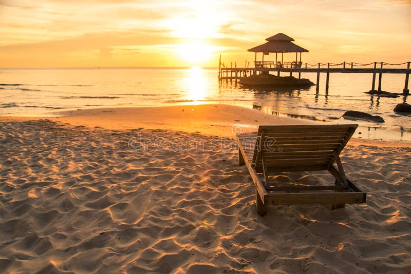 Chair on the Beach and Pavilion in Sunset Stock Image - Image of chairs ...