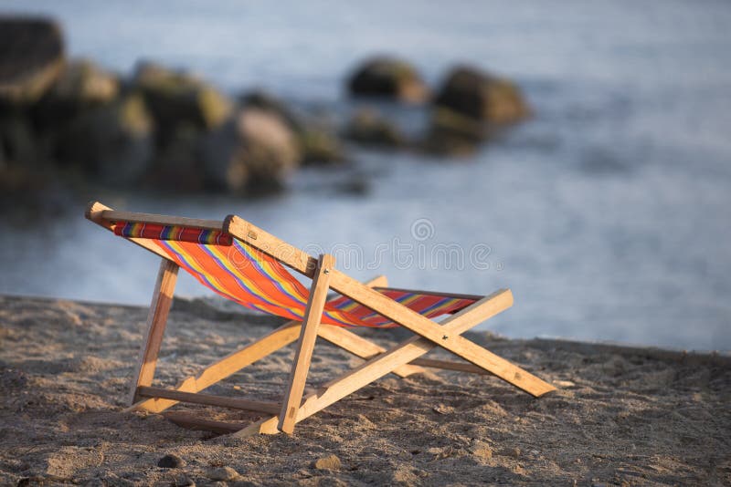 A Chair on the Beach View Stone Stock Photo - Image of sunny, nature ...