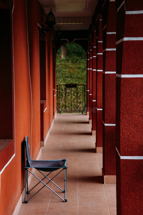 Chair and Columns in Gallery Stock Image - Image of arcade, passage ...