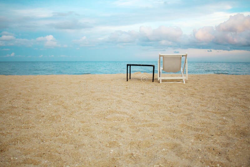 Chair and desk on beach stock image. Image of coast - 187826115
