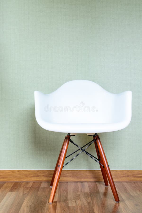 Chair in Empty Room Against a Green Wall Stock Photo - Image of detail ...