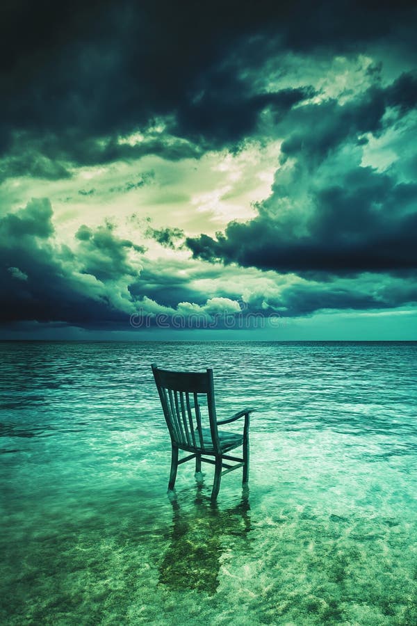 A Chair Floating in an Endless Ocean Under a Dramatic Stormy Sky. Stock ...