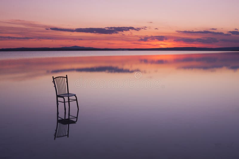 Chair on a Lake at Sunset with Beautiful Colours Stock Image - Image of ...