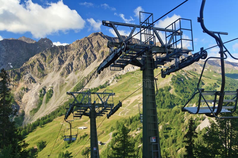 Chair lift in Italian Alps stock image. Image of mountain - 22707915