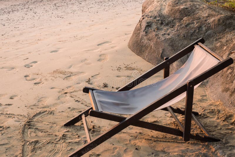A chair on the sand beach stock image. Image of island - 110118363
