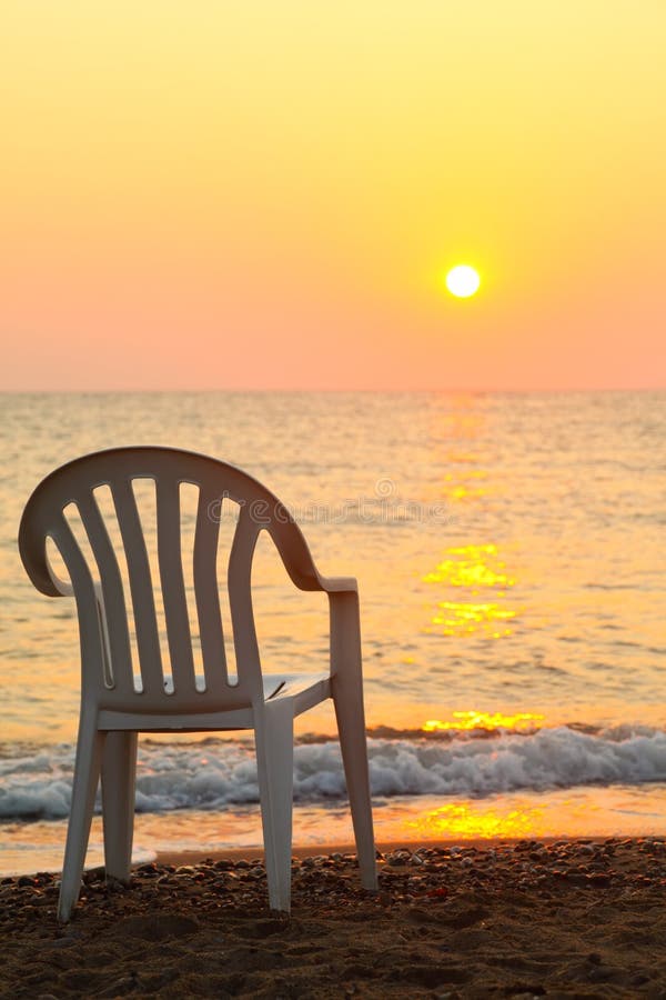 Chair is on Seashore. Beautiful Orange Sunset Stock Photo - Image of ...