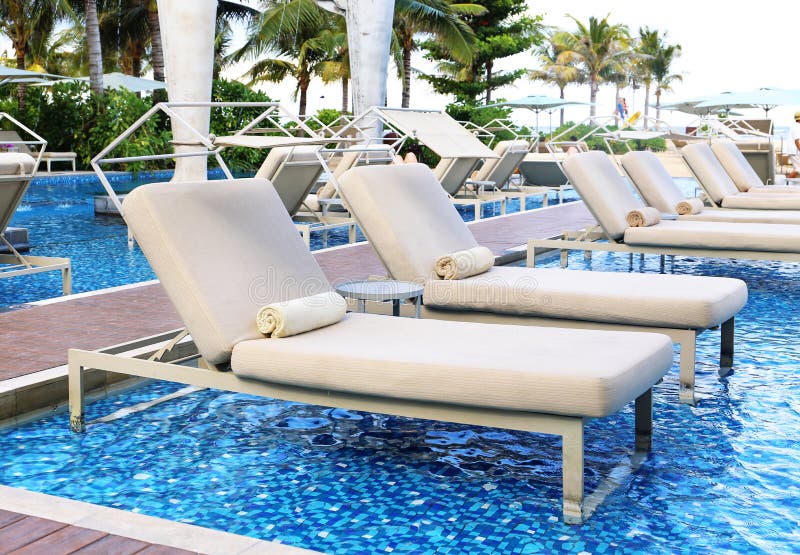 Chair side swimming pool stock photo. Image of bower - 70284238