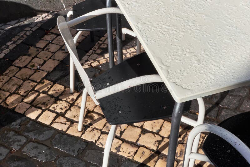 A Chair and a Table in a Cafe on the Street Wet Stock Image - Image of ...