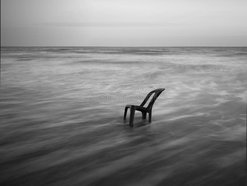 Stuck Chair Cover in the Big Waves Stock Photo - Image of chairs, stuck ...