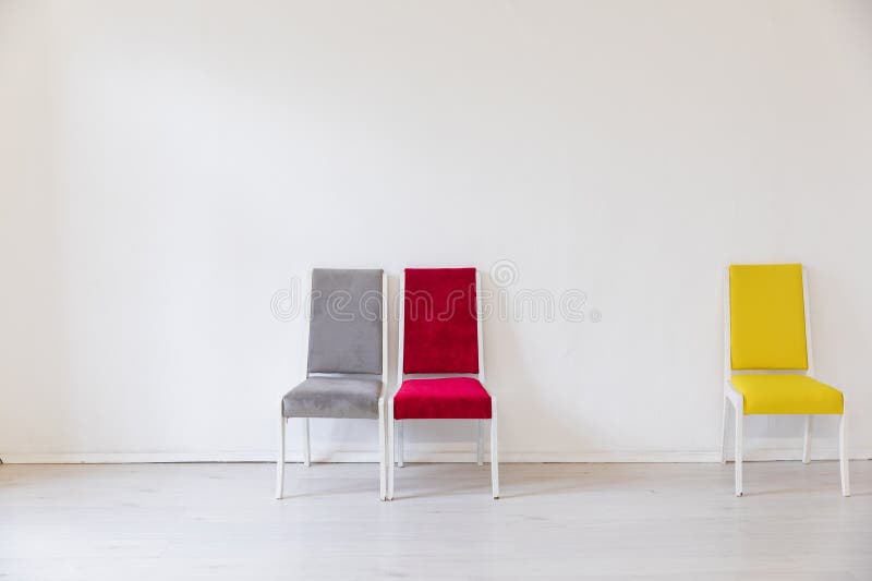Chairs of Different Colors in the Interior of a White Room Stock Image ...