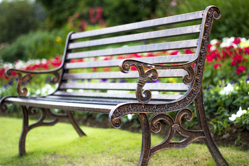 Chairs in flower garden stock image. Image of flower - 83749189