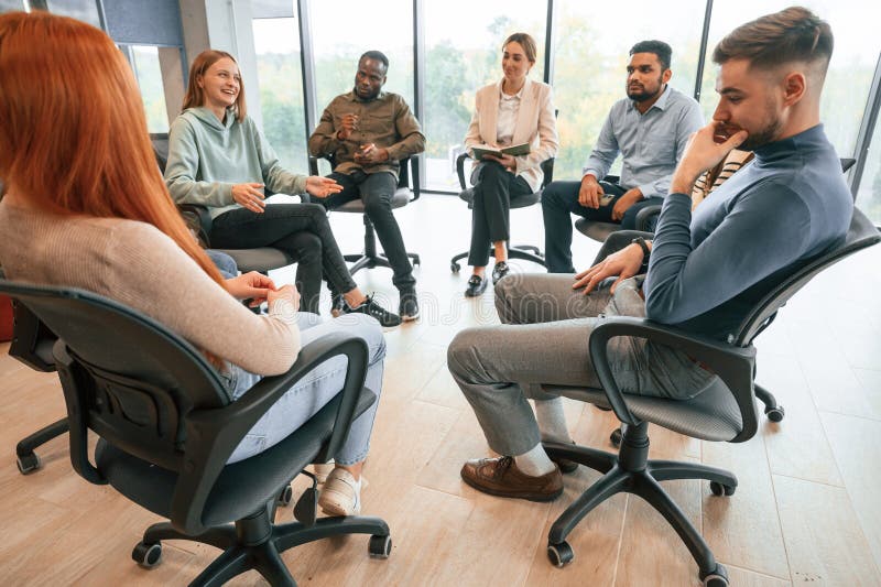 On the Chairs. Group of People are Having Therapy Meeting Together ...