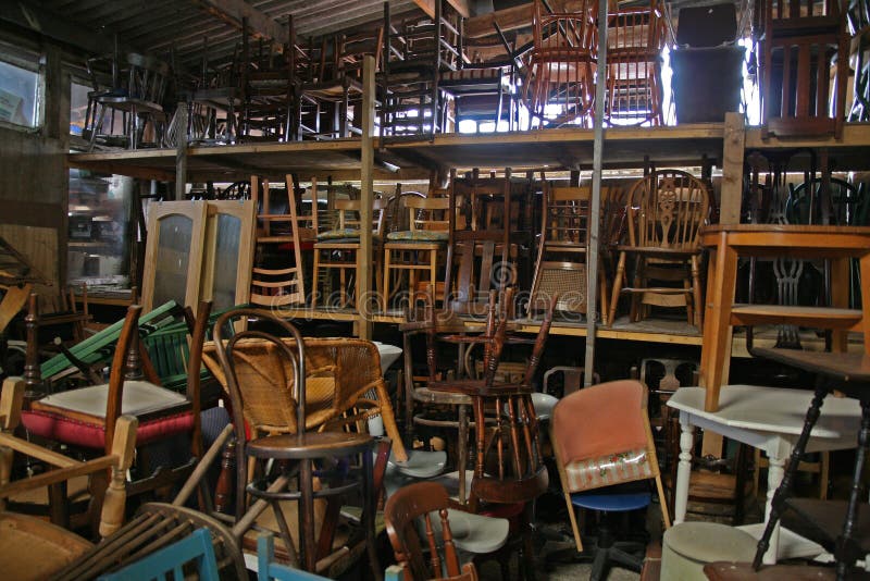 Chairs piled high stock image. Image of wooden, chairs - 58139413