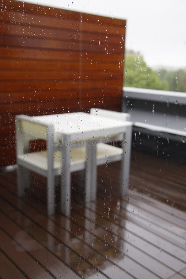 The chairs in rain stock image. Image of travel, chairs - 56084643