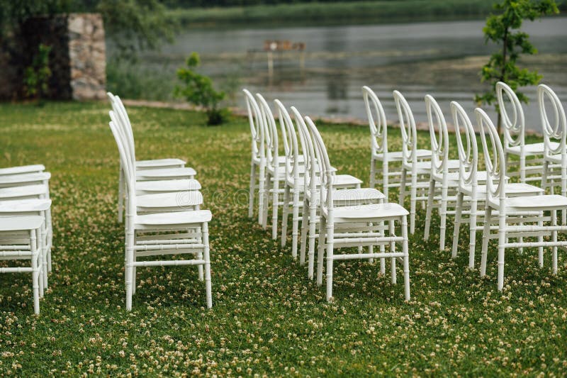 Chairs Set Up by the Green Lawn in Preparation for a Wedding Reception ...